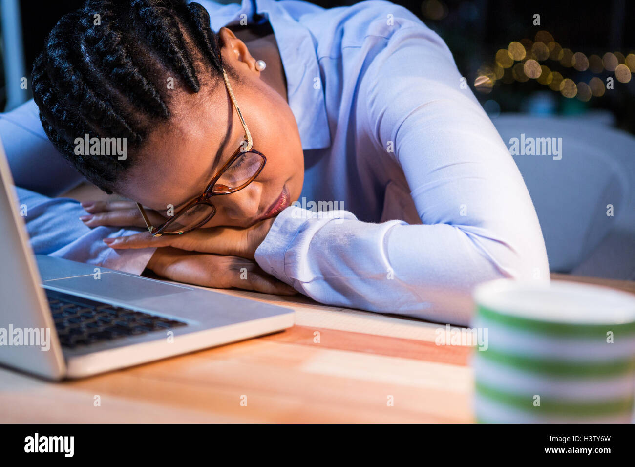 Tired businesswoman sleeping on the desk Stock Photo - Alamy