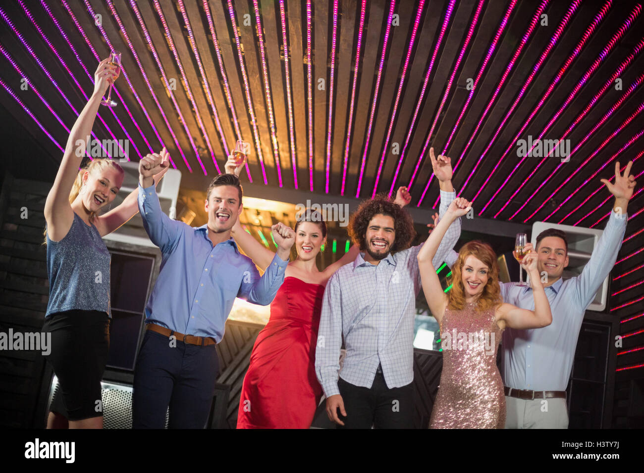 Smiling friends dancing on dance floor Stock Photo - Alamy