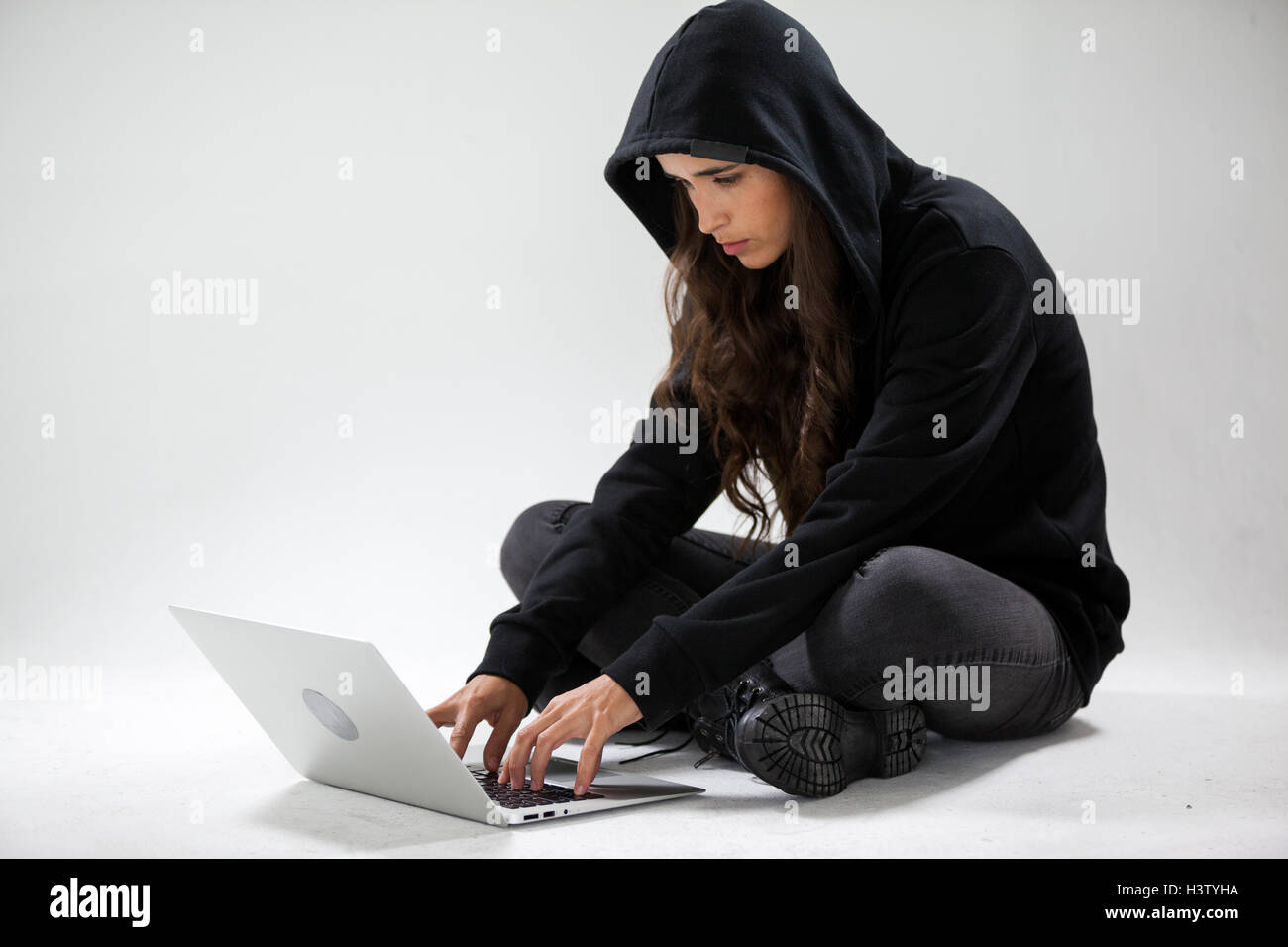 Female computer hacker sitting laptop hi-res stock photography and ...