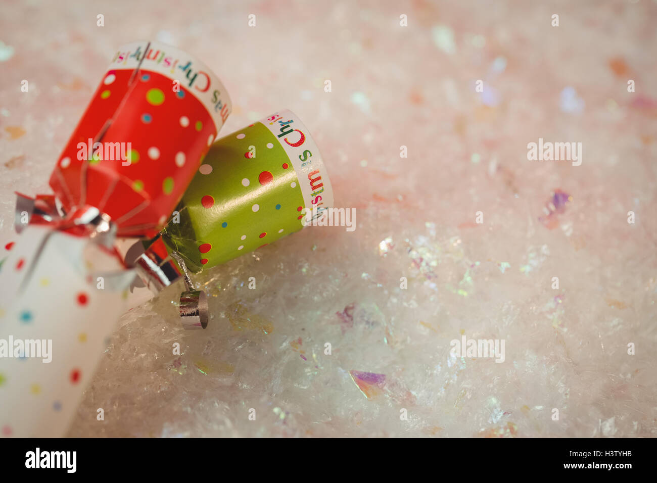 Close-up of christmas crackers on snow Stock Photo - Alamy