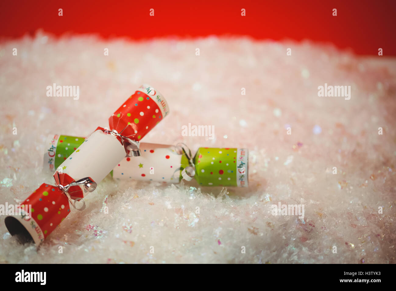 Close-up of christmas crackers on snow Stock Photo - Alamy