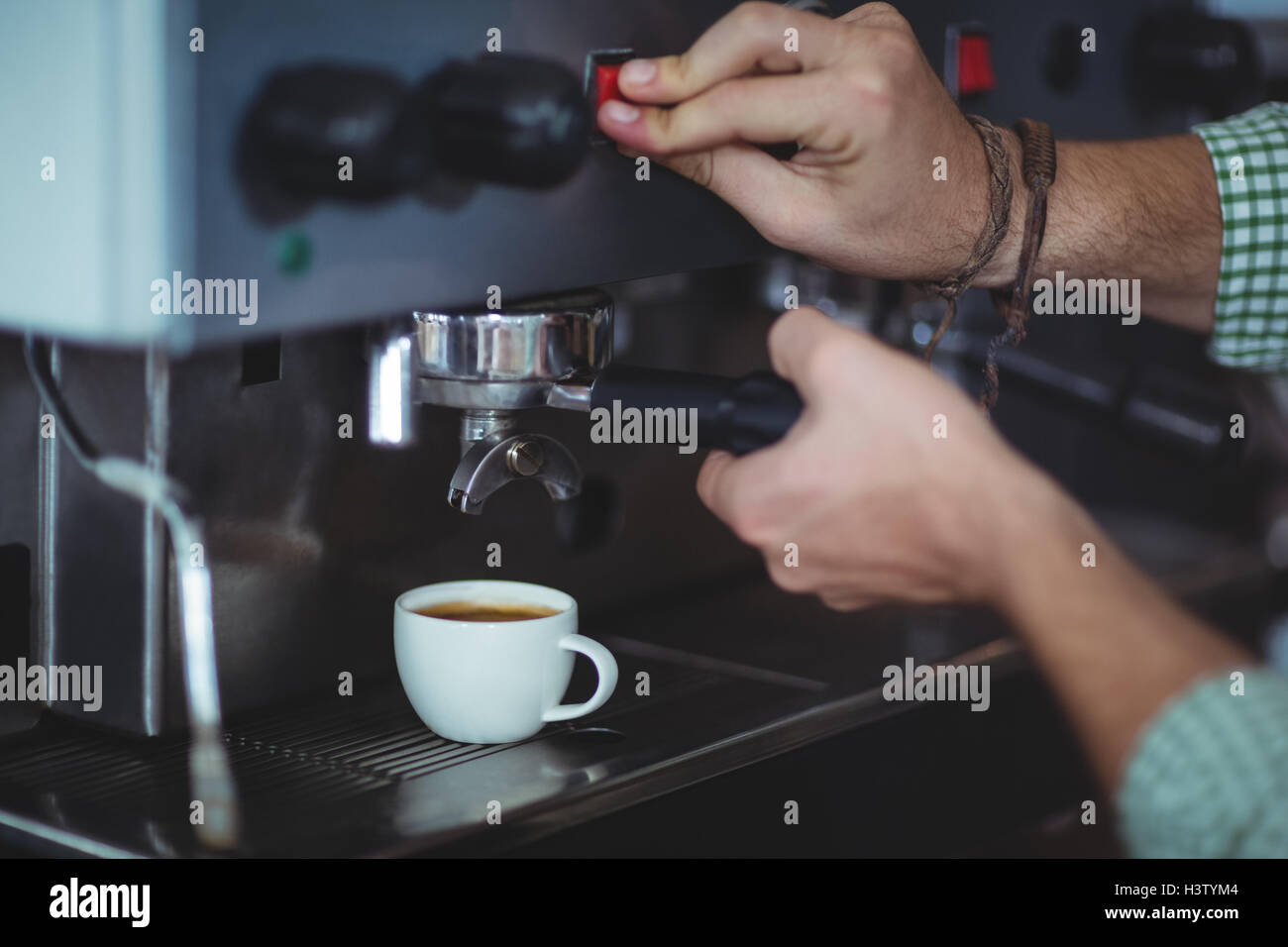 Waiter making cup of coffee Stock Photo - Alamy