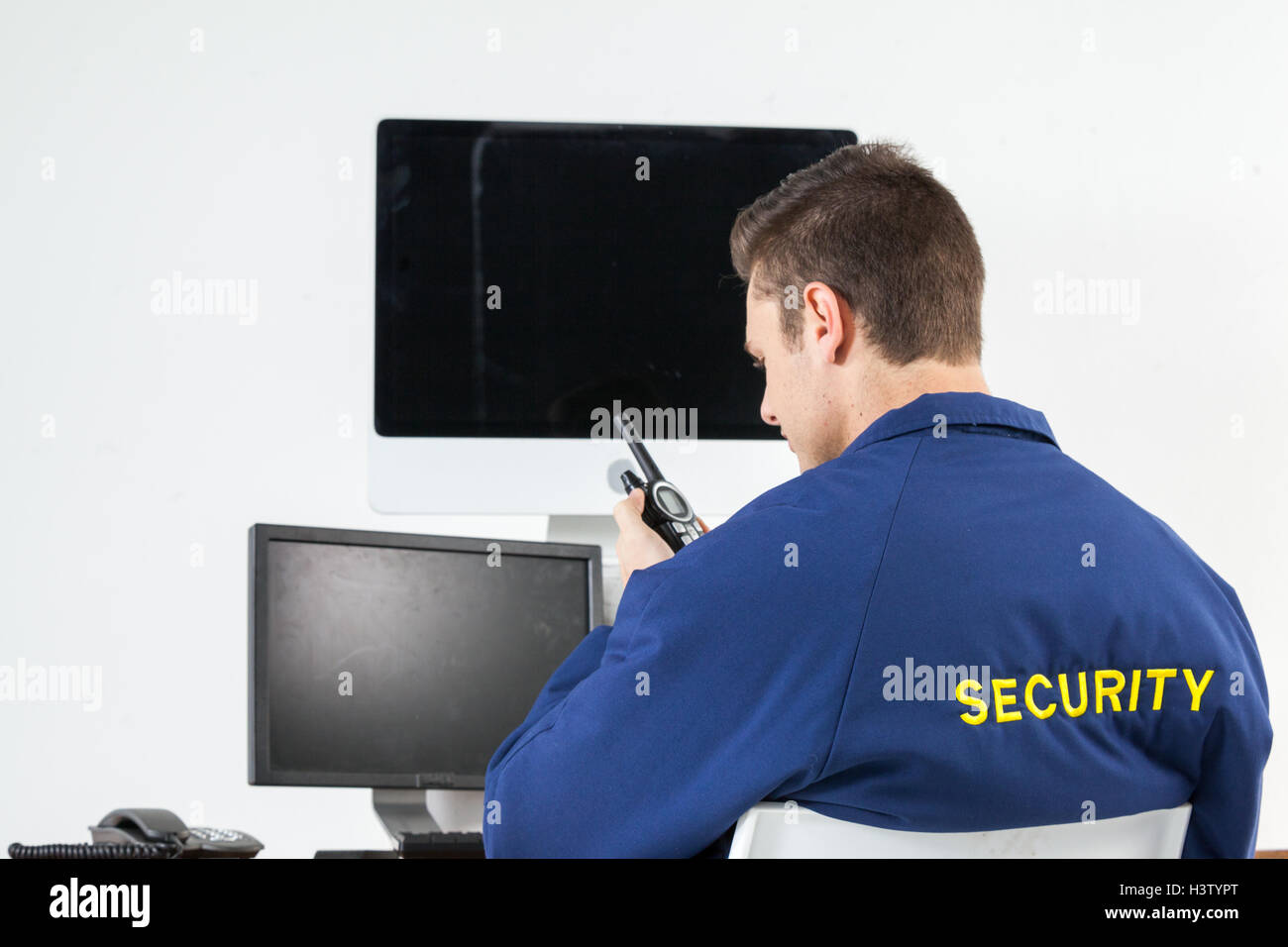 Security officer watching monitors hi-res stock photography and images ...