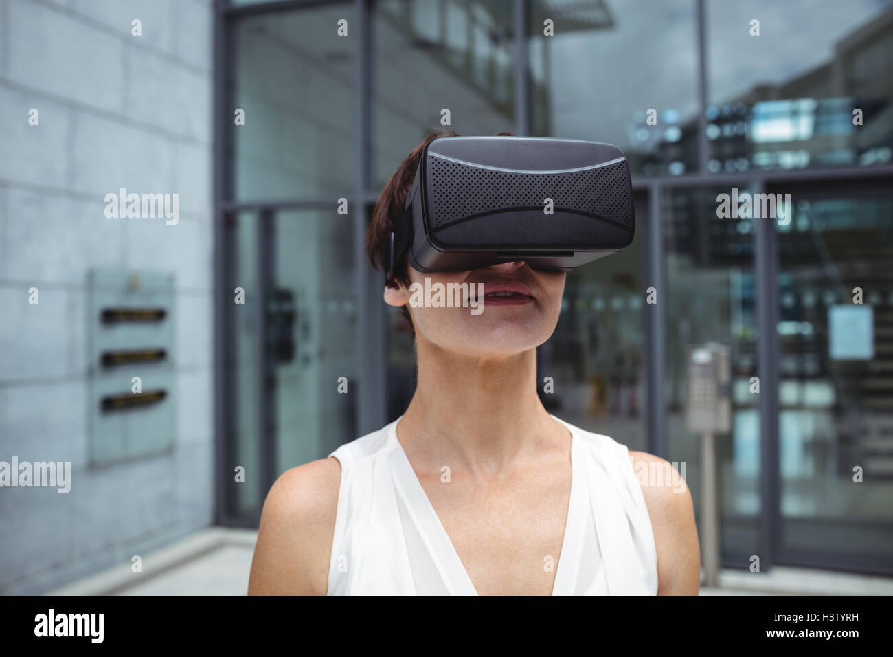 Woman using reality virtual headset Stock Photo - Alamy
