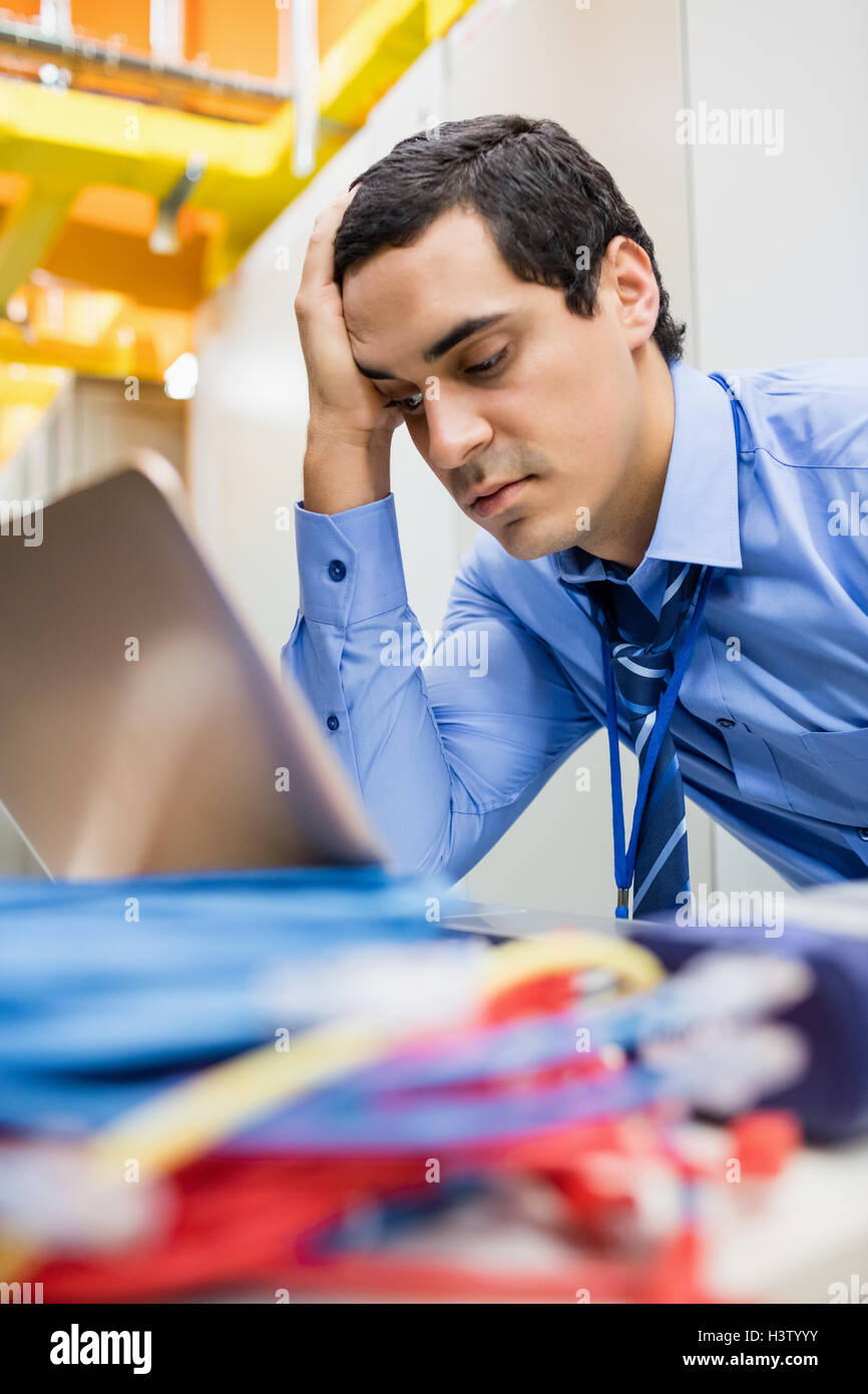 Stressed technician in data center hi-res stock photography and images ...