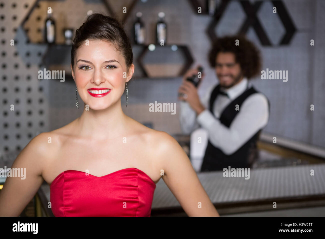 Portrait of beautiful woman standing in bar Stock Photo - Alamy
