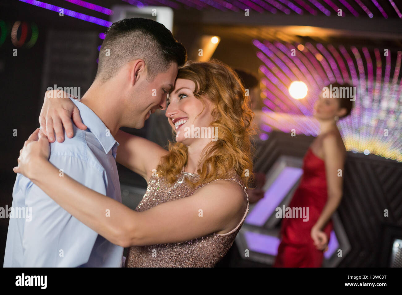 Cute couple dancing together on dance floor Stock Photo - Alamy