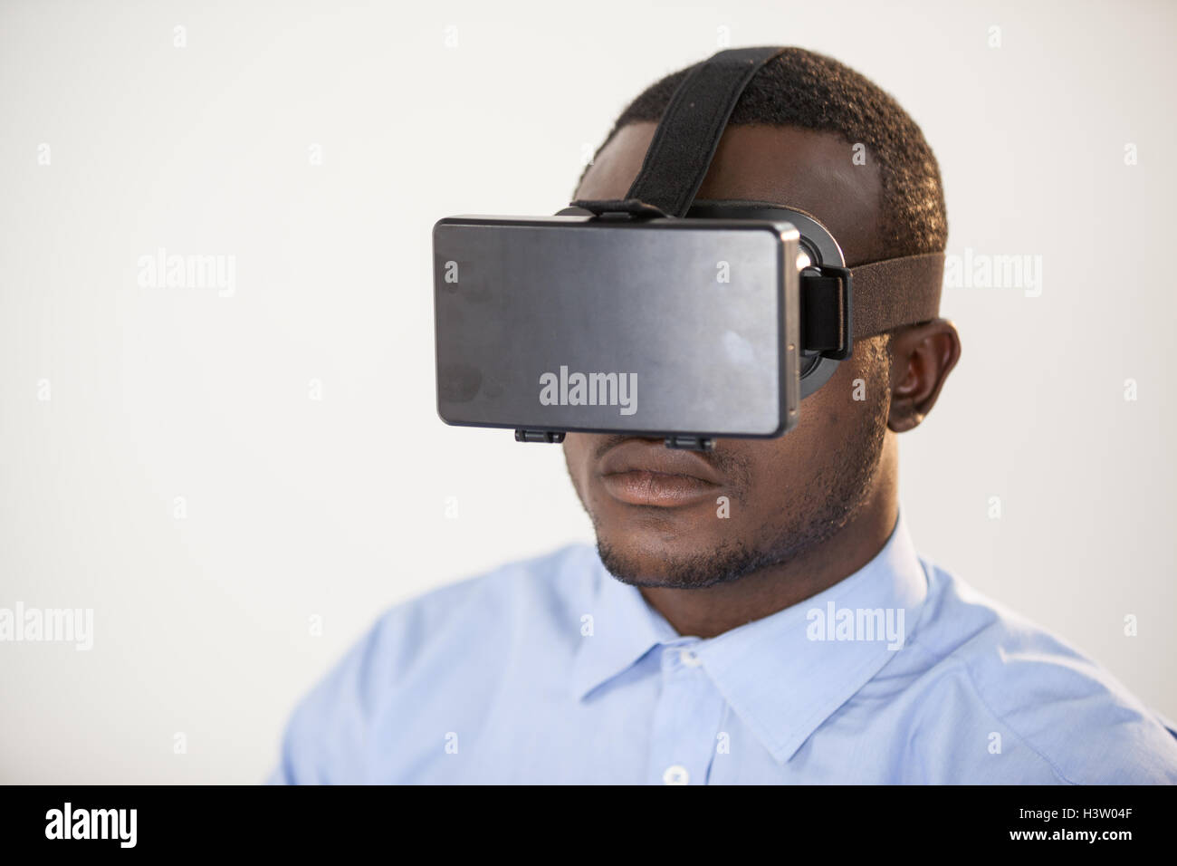 Man using virtual reality headset Stock Photo - Alamy