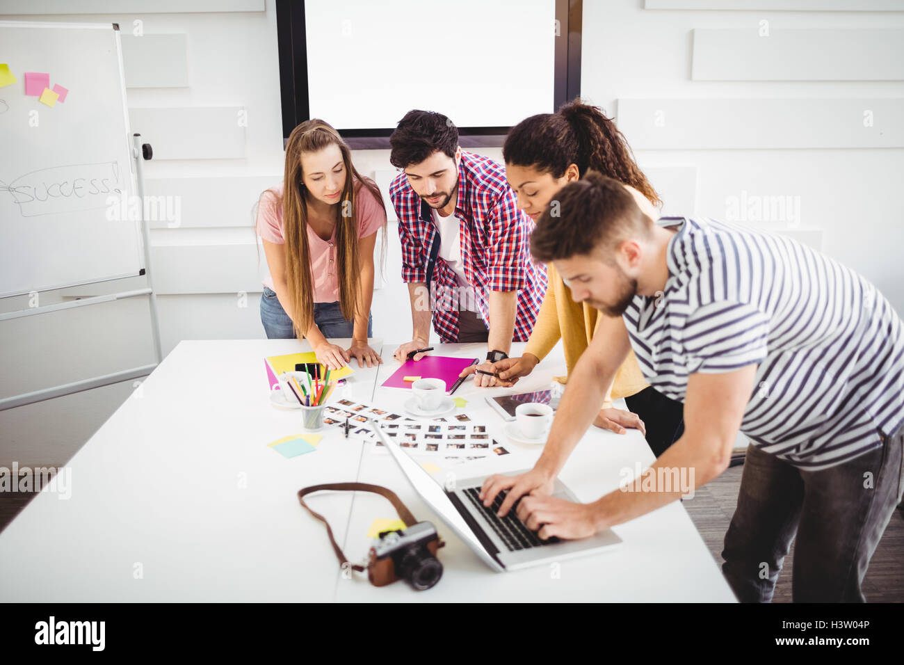 Editors working in photo editing office Stock Photo - Alamy