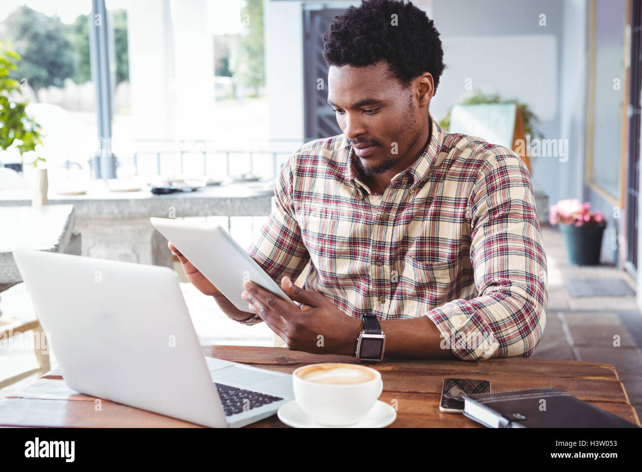 Man using digital tablet Stock Photo - Alamy
