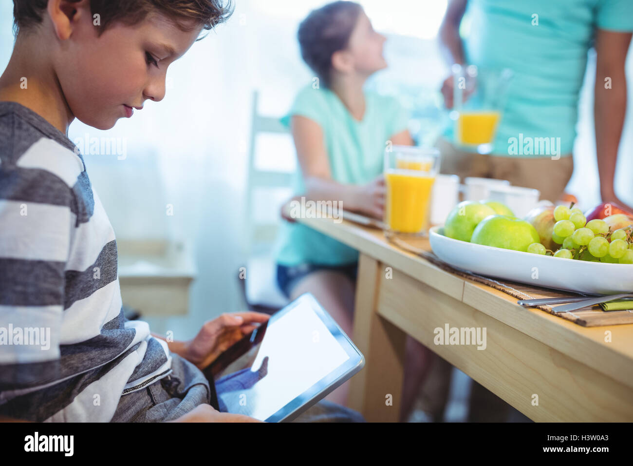 Child tablet table eating hi-res stock photography and images - Alamy