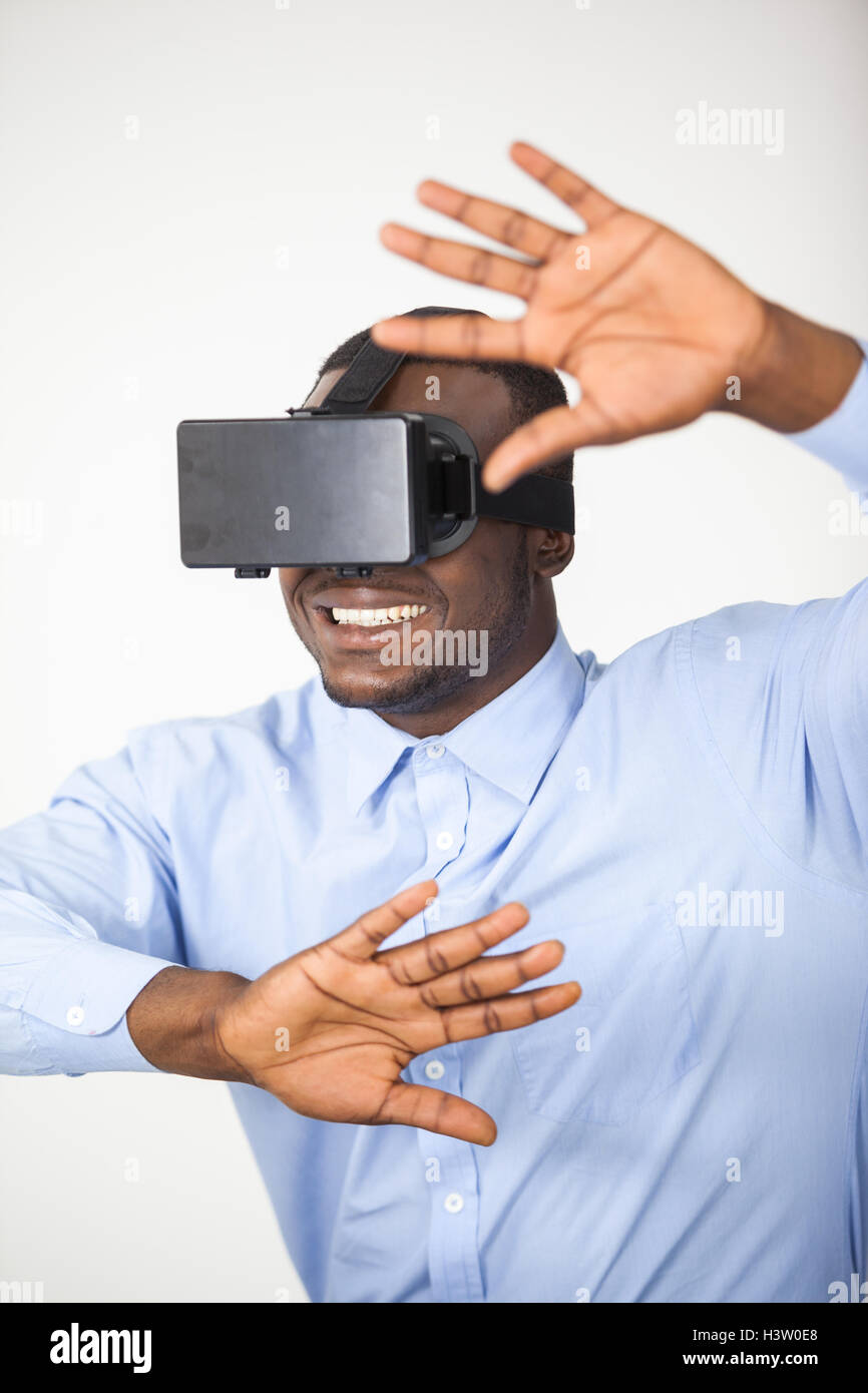 Man using virtual reality headset Stock Photo - Alamy
