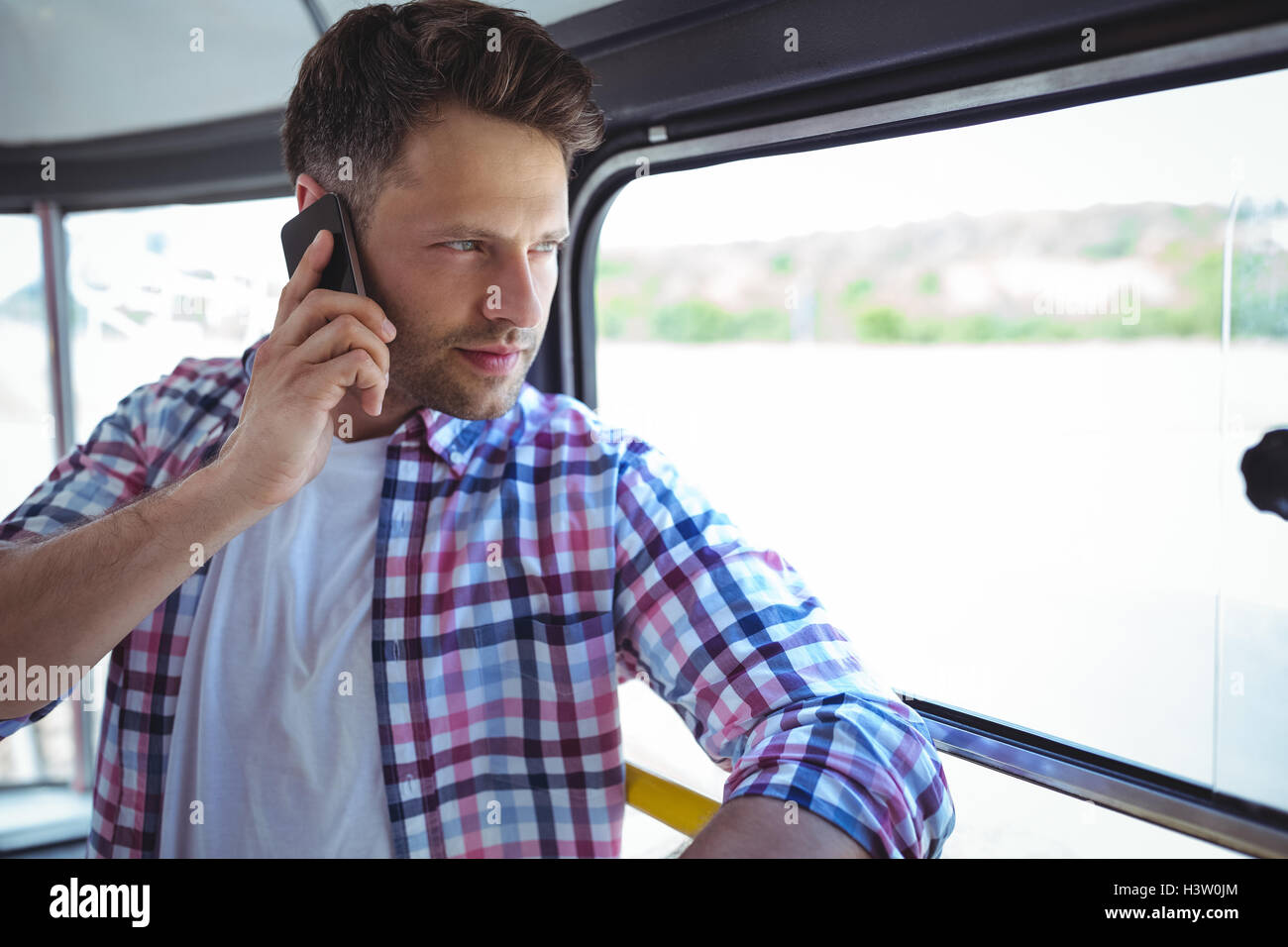Handsome man talking on mobile phone Stock Photo - Alamy