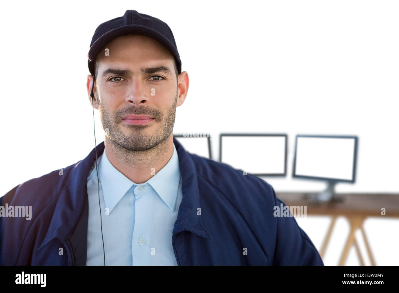 Portrait of security officer with computers in background Stock Photo ...