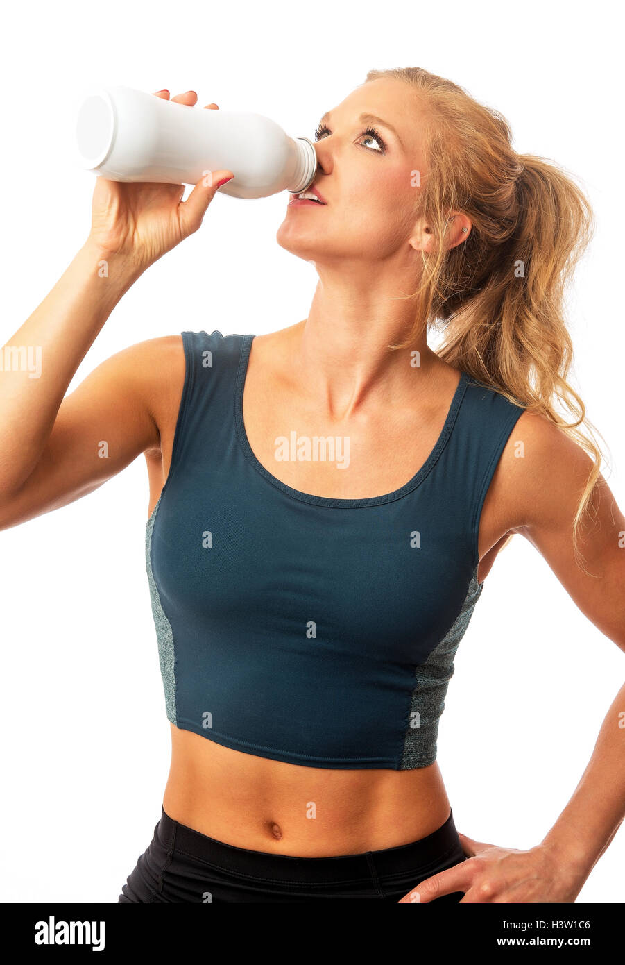 Fitness model posing with water bottle for hydration Stock Photo - Alamy