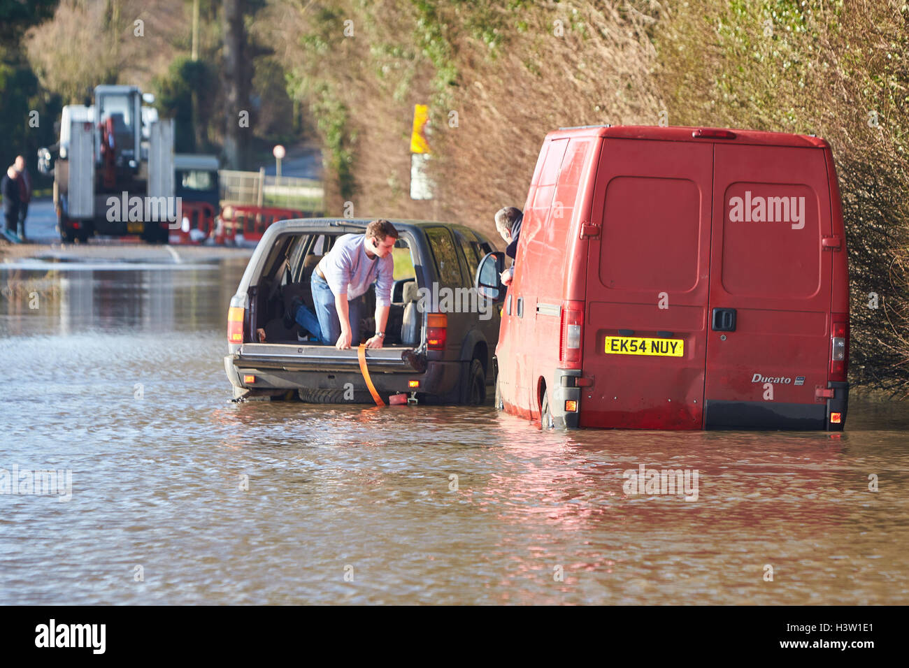 A 4x4 rescuing a red van stuck in flood water on the B4009 just outside ...