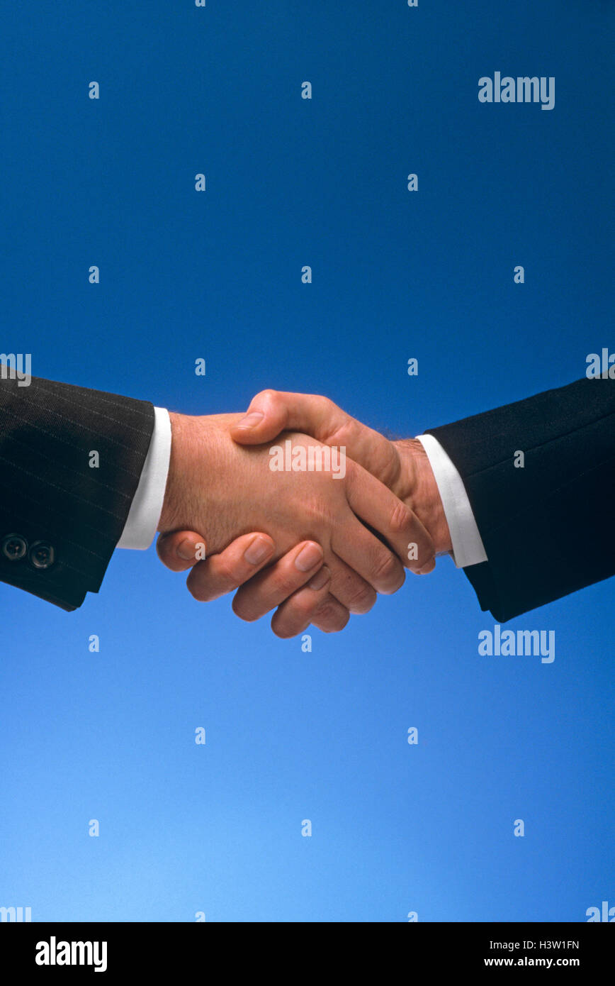 MALE HANDSHAKE AGAINST BLUE BACKGROUND Stock Photo - Alamy