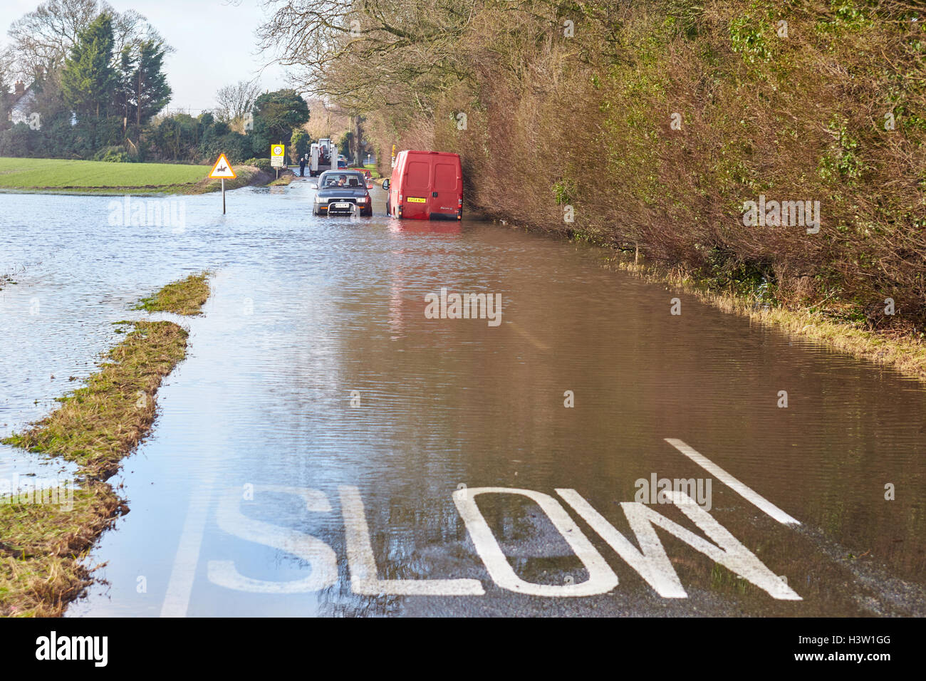A 4x4 rescuing a red van stuck in flood water on the B4009 just outside ...