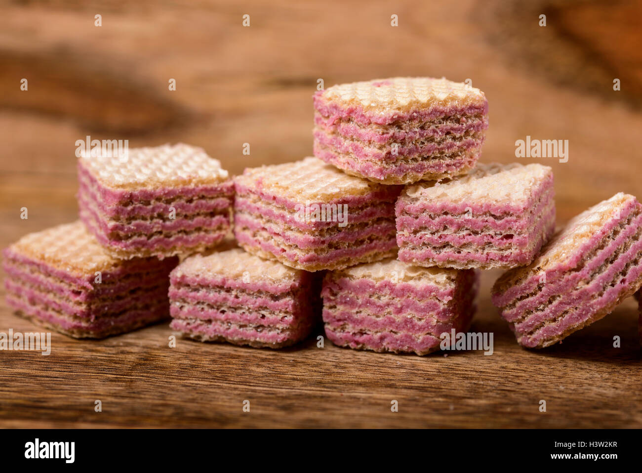macro wafers stuffed with raspberry cream over wood Stock Photo - Alamy