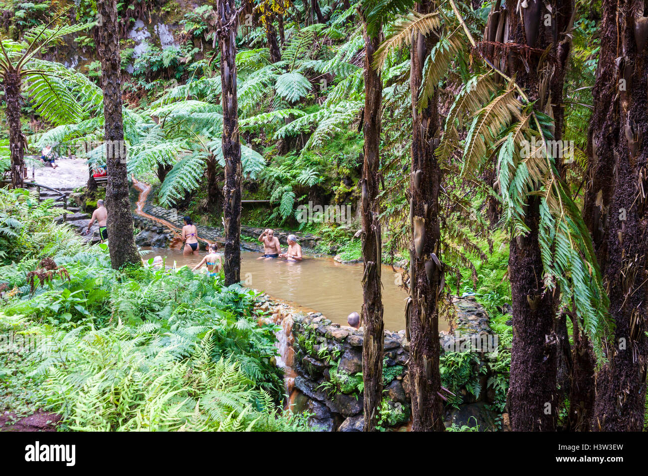 People enjoy bath in natural thermal pools of Caldeira Velha near ...