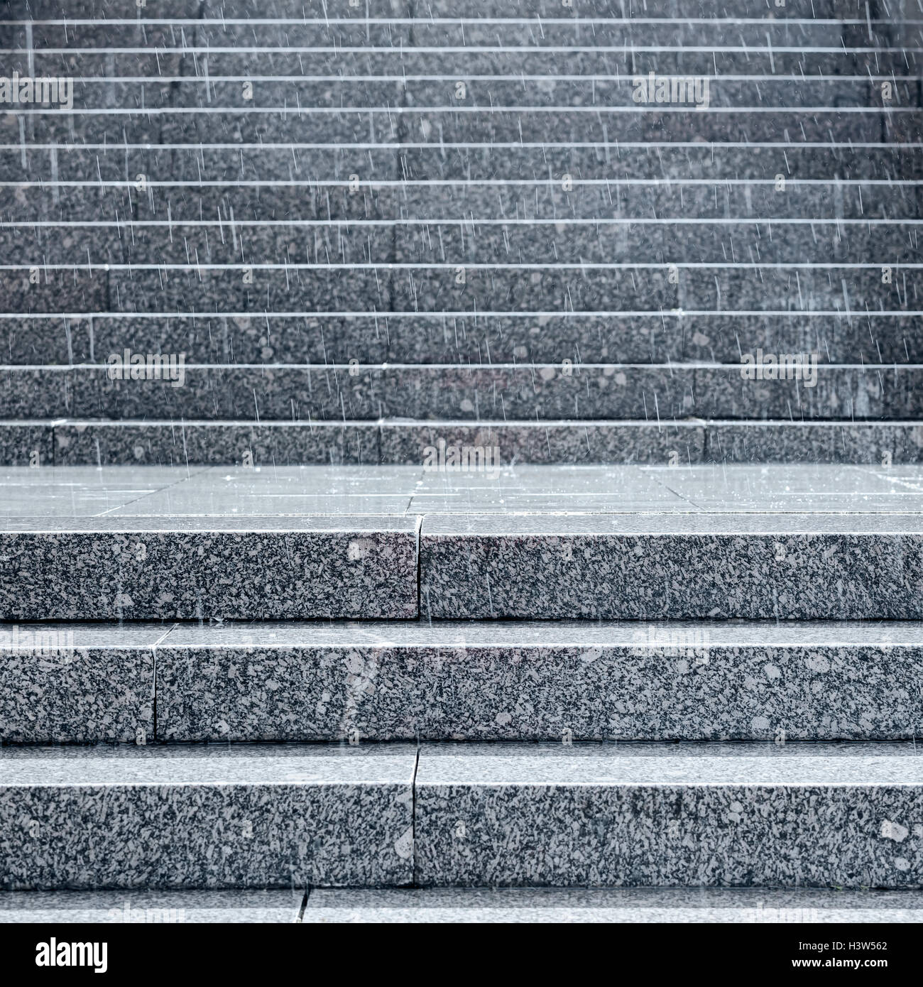 rain splashes on gray granite steps of broad staircase Stock Photo - Alamy