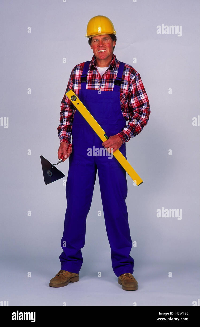 Man, working trousers, level, tennis racket, safety helmet ...