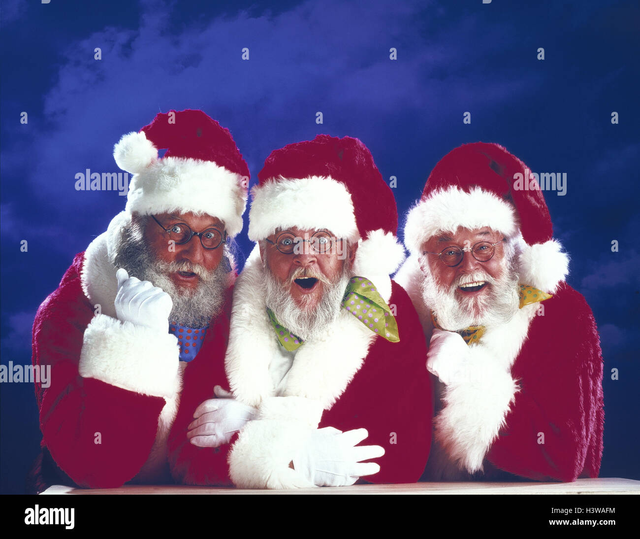 Three Santas High Resolution Stock Photography and Images - Alamy