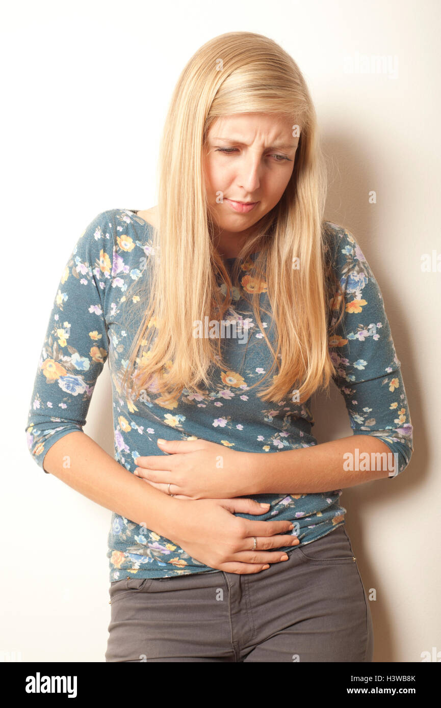 young woman having stomach ache Stock Photo - Alamy