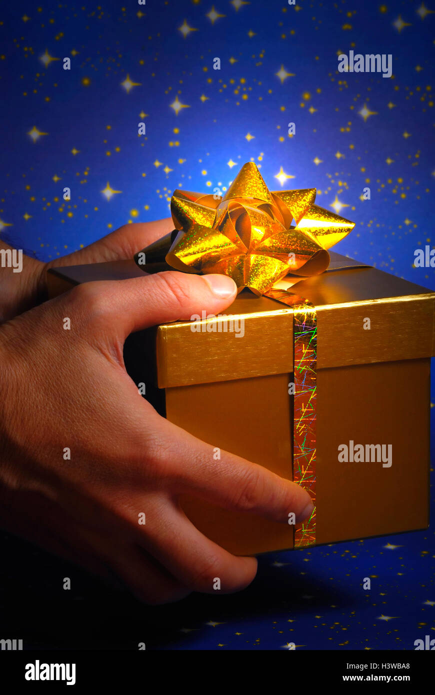 male hand giving a present box Stock Photo - Alamy
