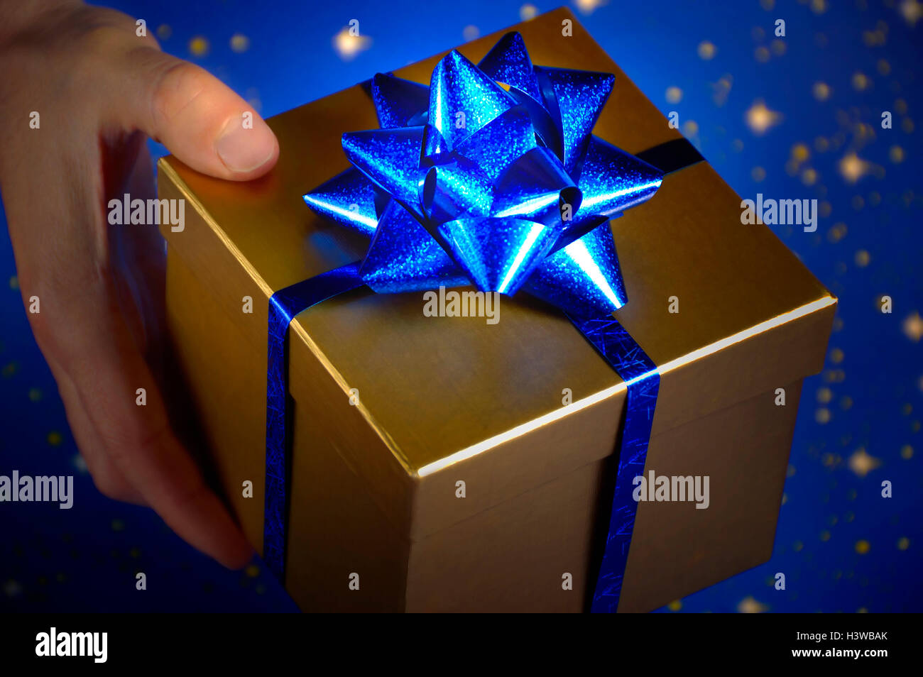 male hand giving a present box Stock Photo - Alamy