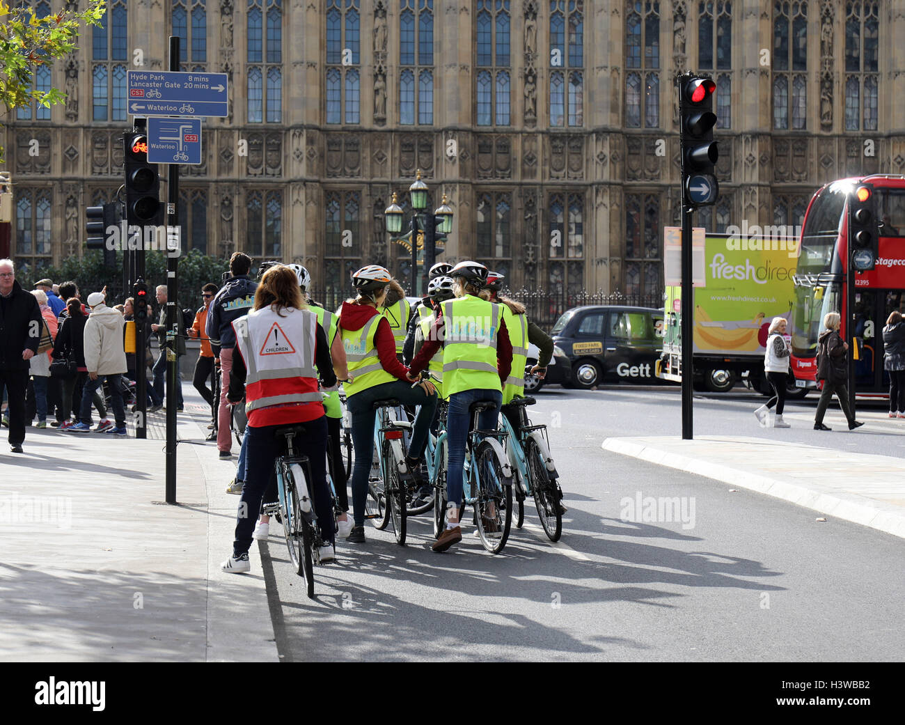 Cyclists using cycle lane traffic light segregated Stock Photo - Alamy