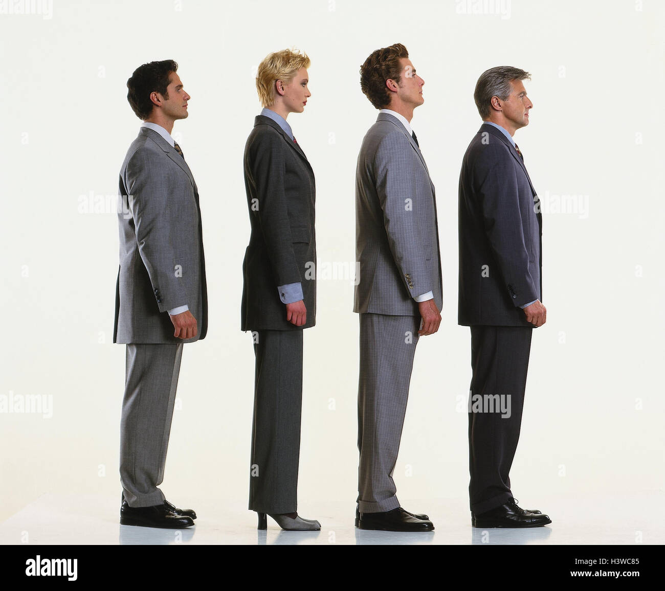 Business people, four, stand, series, side view, professions, studio ...