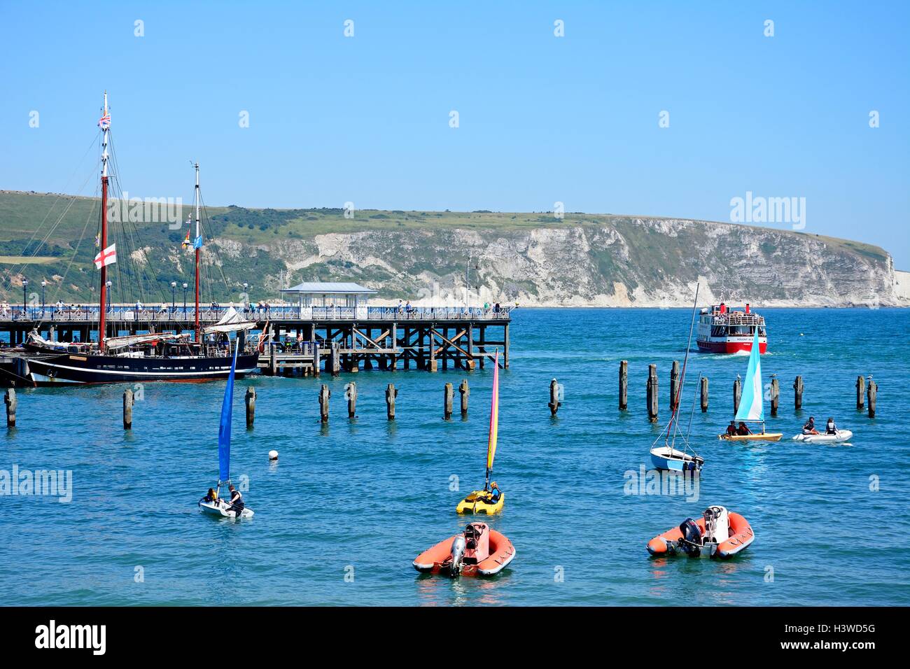The Moonfleet tallship moored alongside the Victorian pier with ...