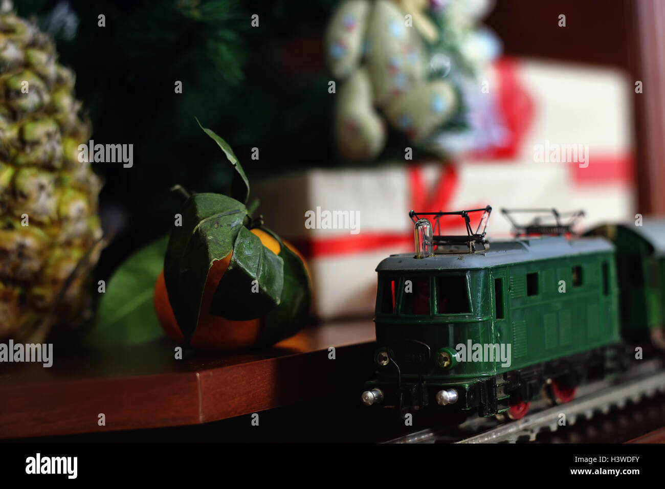 train under tree gift Stock Photo - Alamy