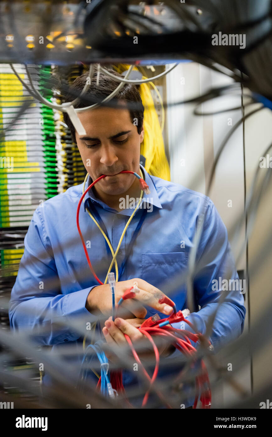 Technician fixing cable Stock Photo - Alamy Technician fixing cable Stock Photo - Alamy