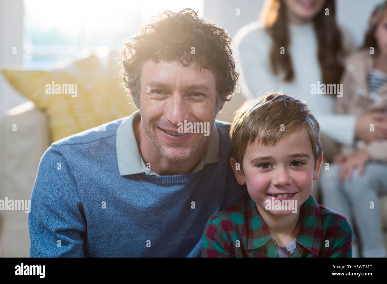 Portrait of father and son smiling Stock Photo - Alamy