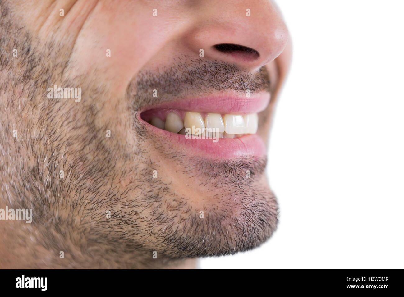 Man showing his teeth Stock Photo - Alamy