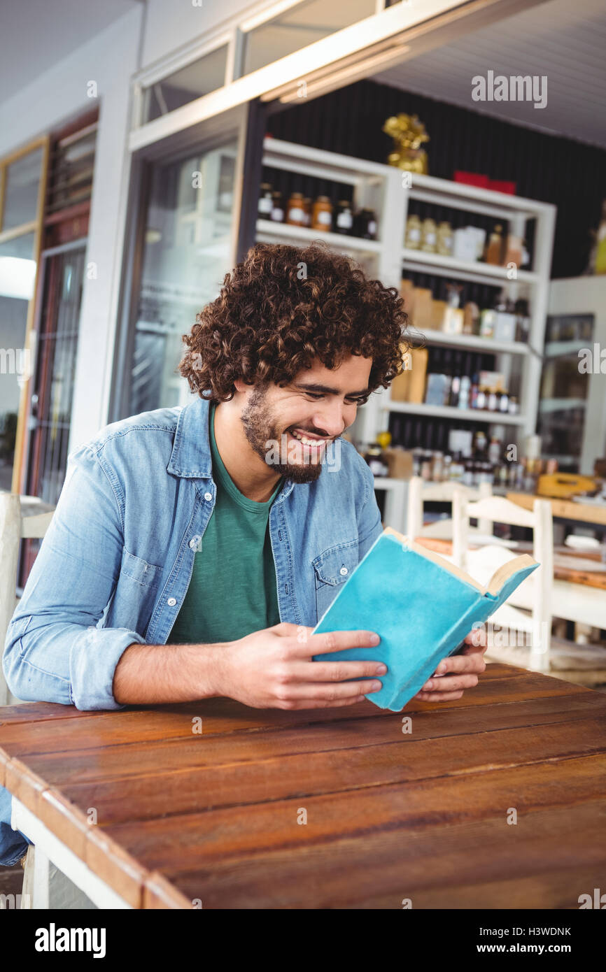 Man reading a book Stock Photo - Alamy