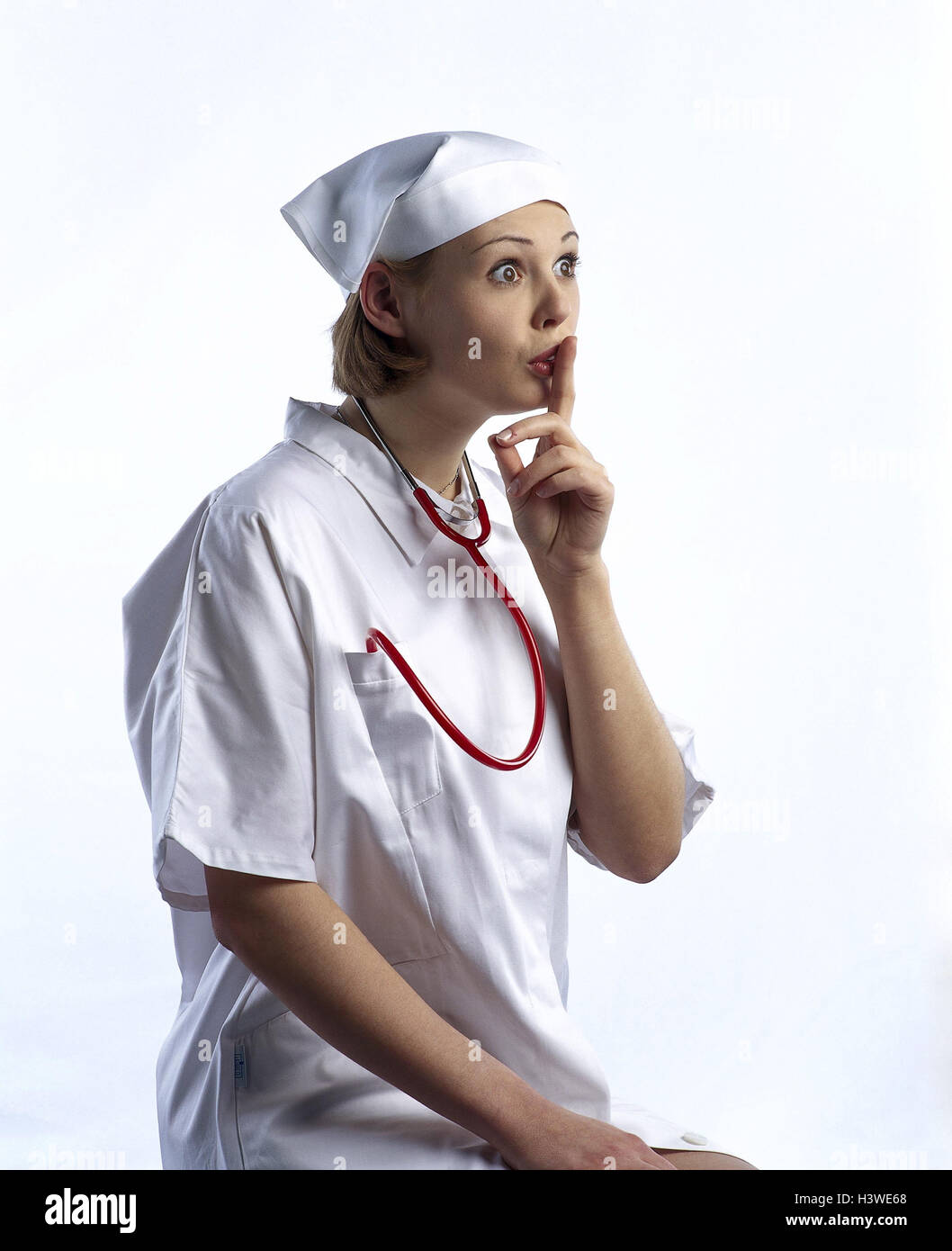 Nurse, gesture, silence, quiet, studio, half portrait, side view ...
