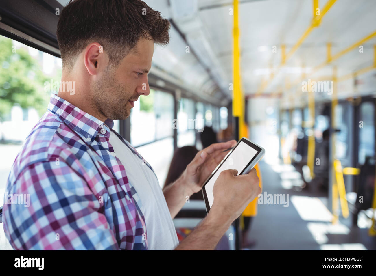 Handsome man using digital tablet Stock Photo - Alamy