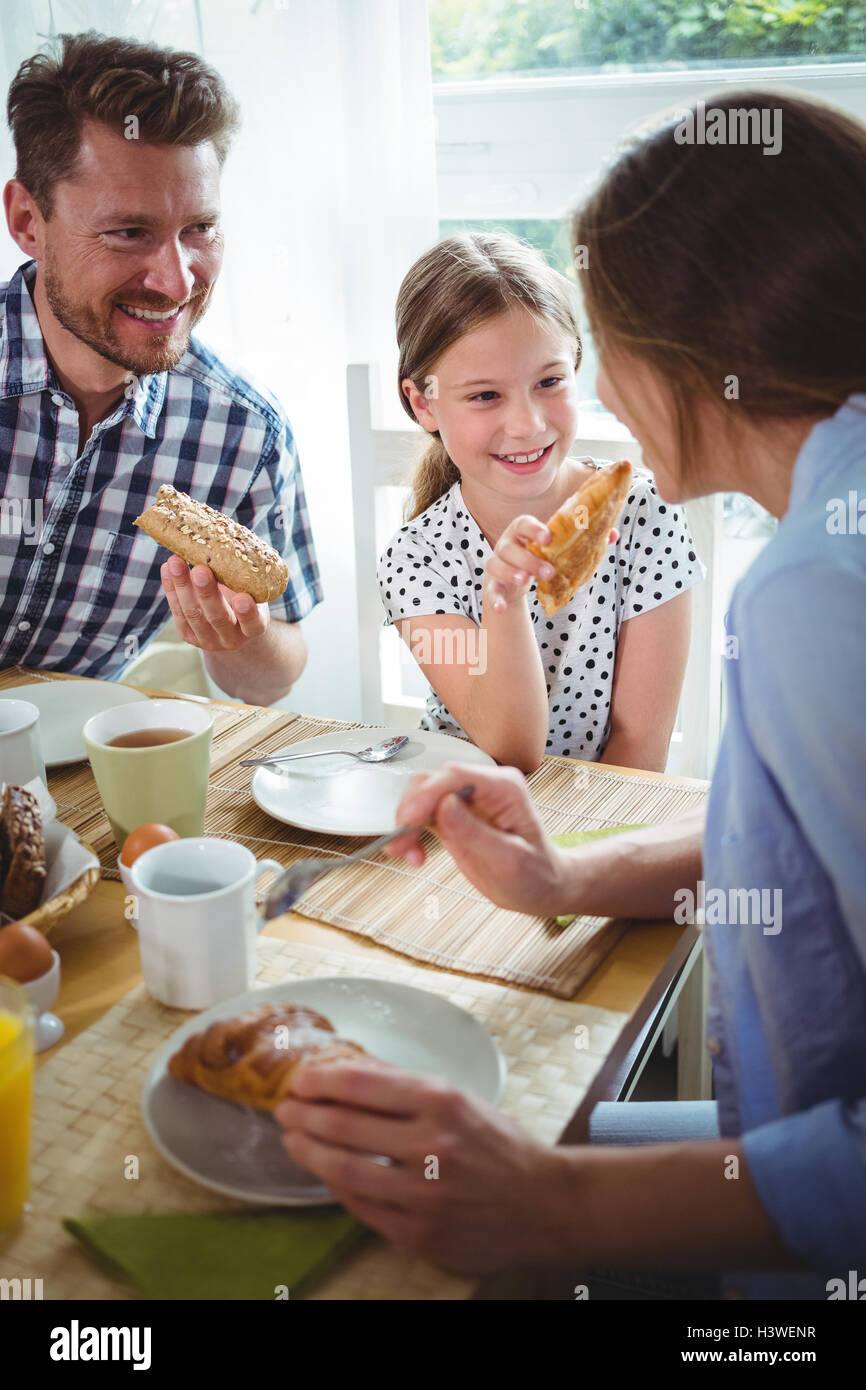 Happy family having breakfast Stock Photo - Alamy