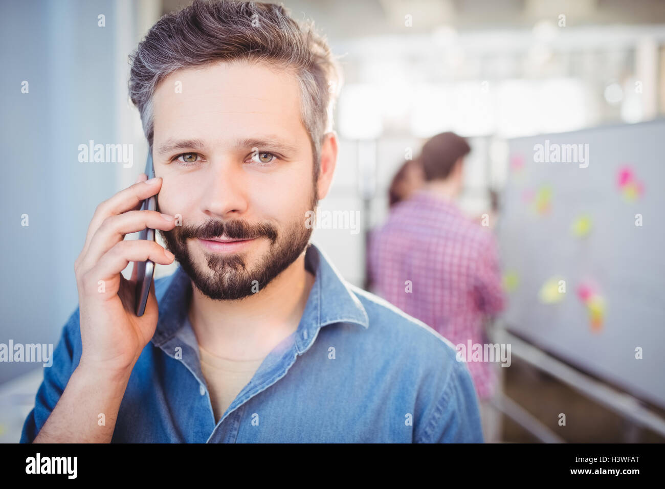 Portrait confident businessman listening hi-res stock photography and images - Alamy