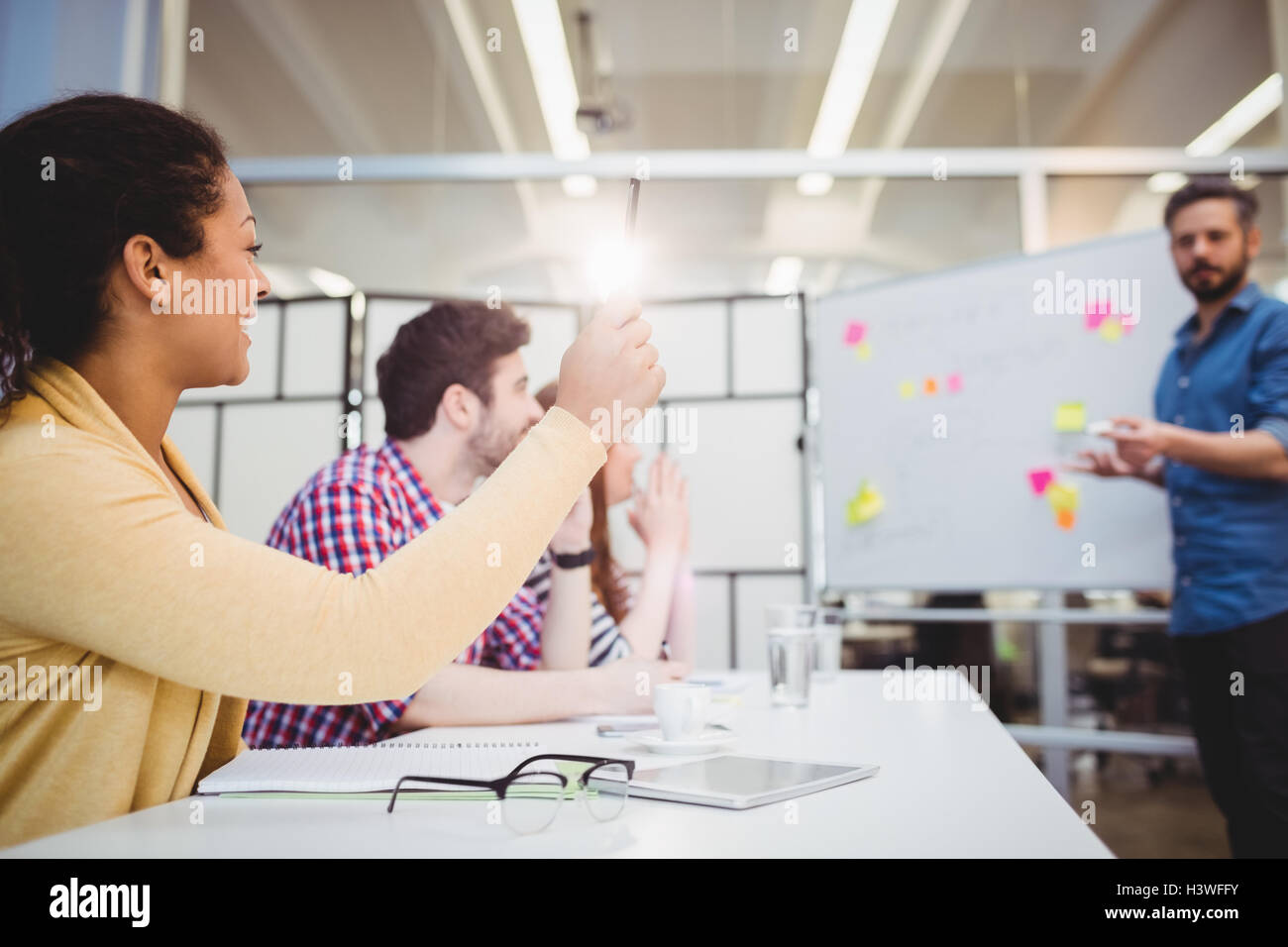 Colleagues in board room during brainstorming session at creative ...
