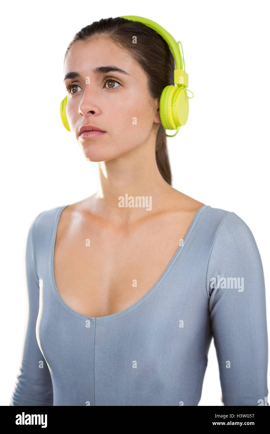 Woman in exercise outfit wearing headphones Stock Photo - Alamy