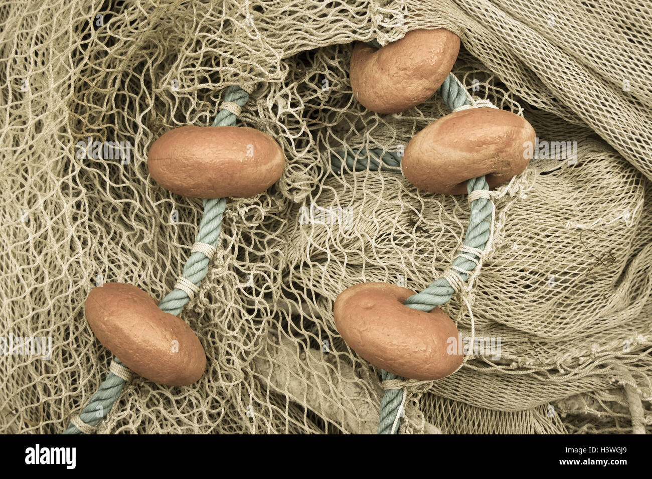 Used fishing net with floaters Stock Photo - Alamy