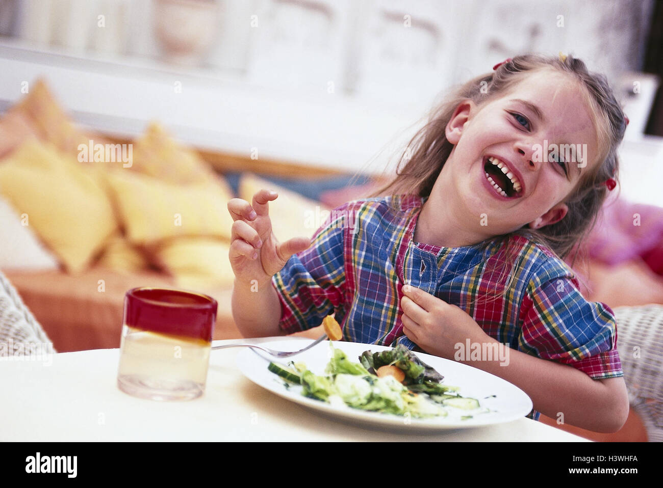 Girls, happy, eat, plates, vegetables, salad inside, table, sit, child ...