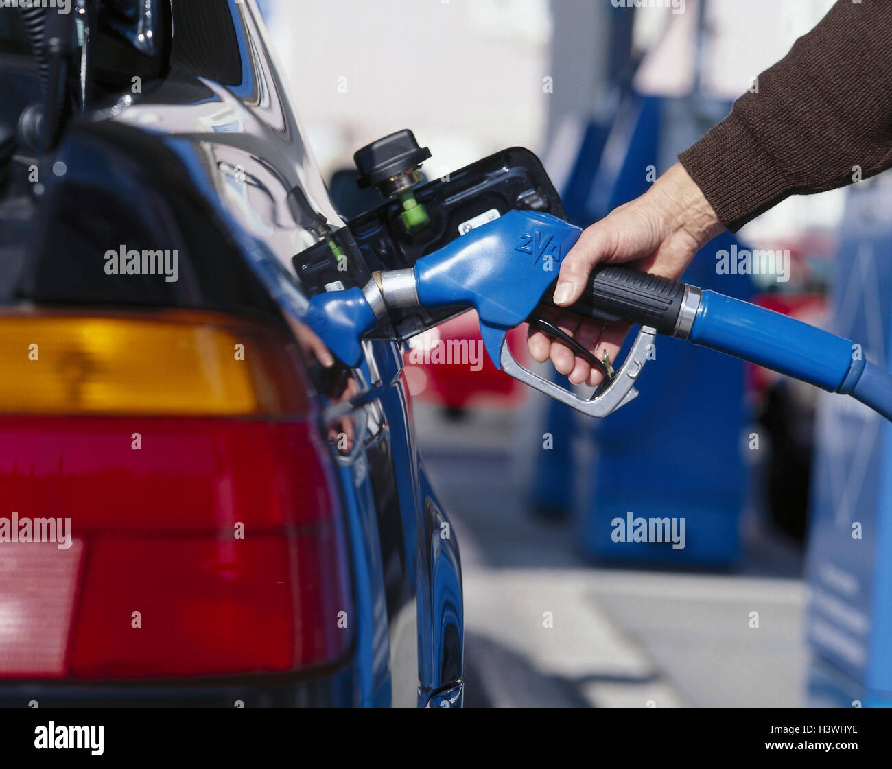 Filling station, man, detail, hand, refuel, car, nozzle, tank orifice ...