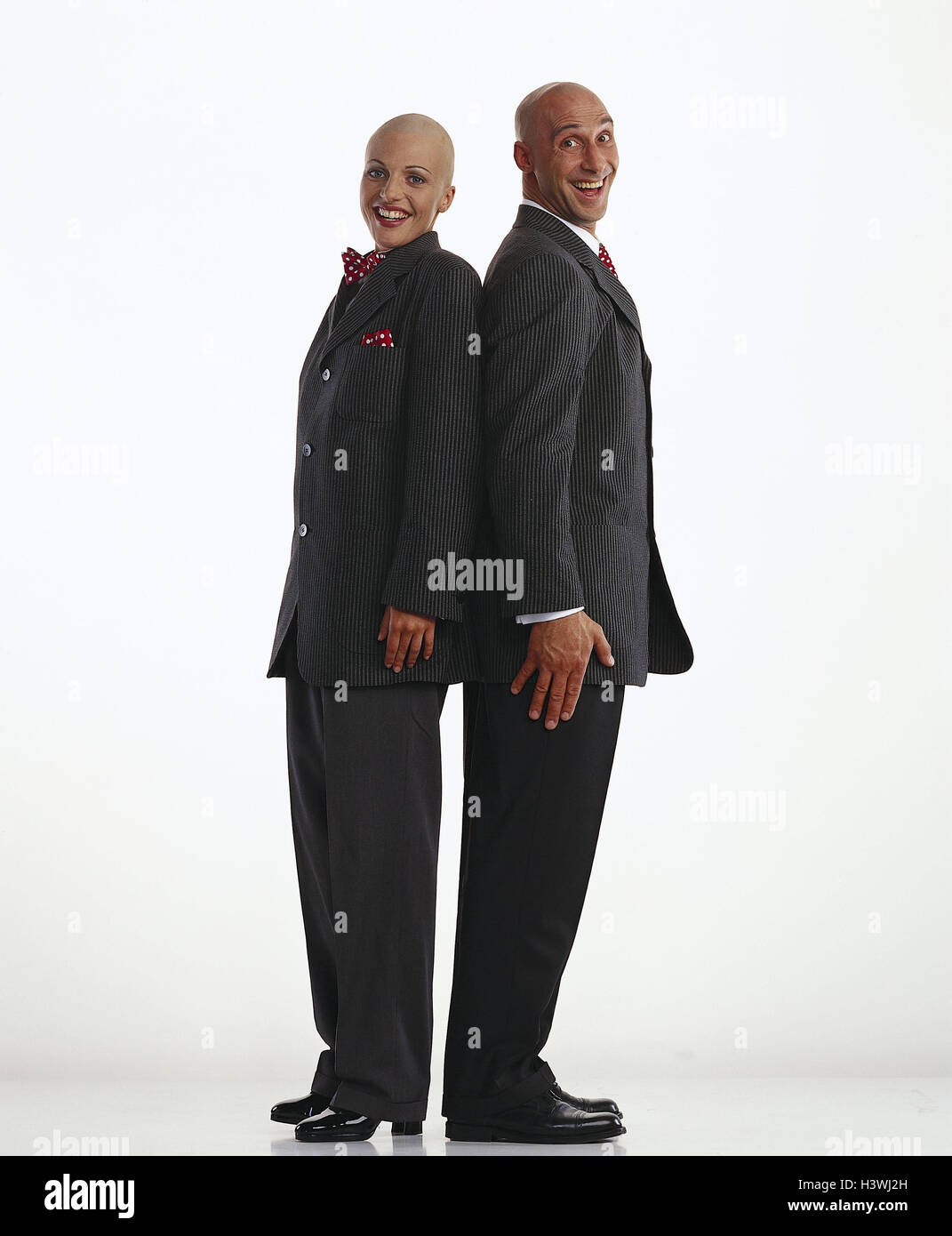 Couple, bald head, suit, back in back, studio mb 188 A5 Stock Photo - Alamy