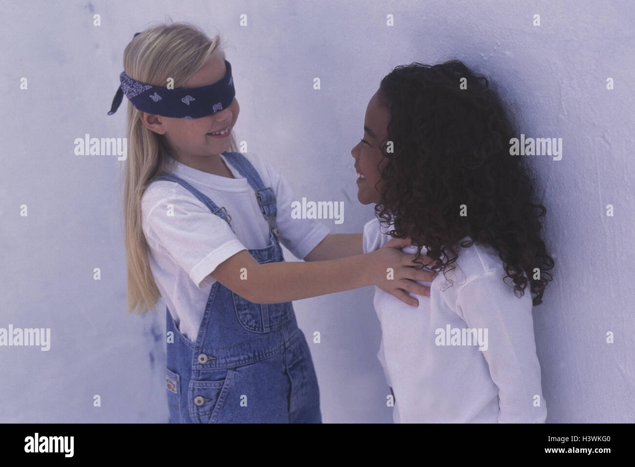 Girls, different colour of skin, play, "Blindman's Buff" friends ...