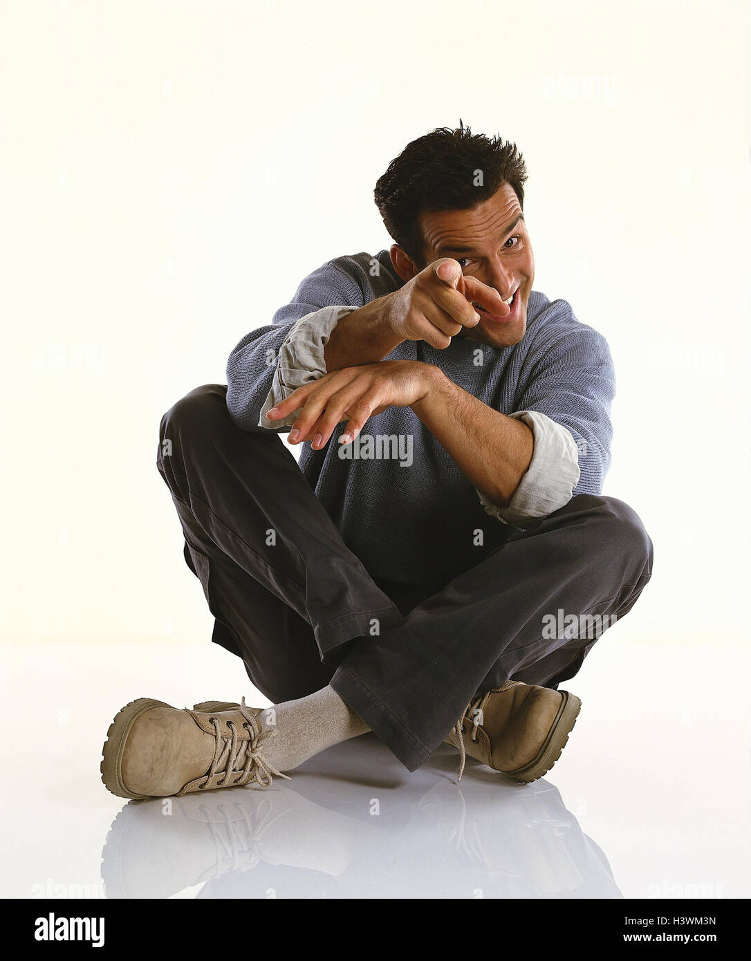 Man, young, cross legged, gesture, pointing, tip, happy, Men, cut outs ...